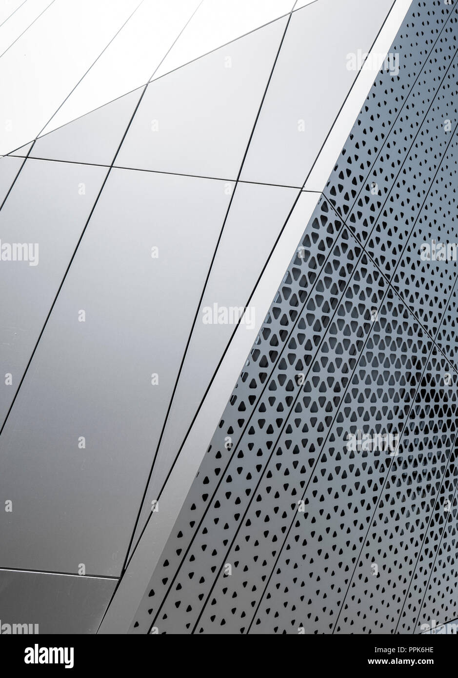 Building with white aluminum facade and aluminum panels Stock Photo - Alamy