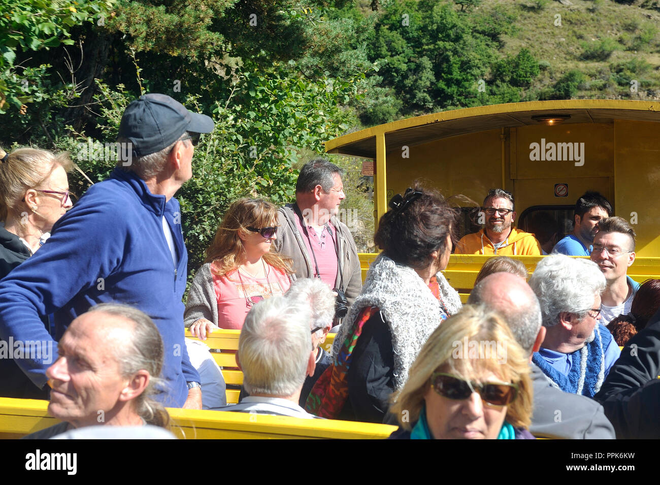 The travelers of the little yellow train of the Pyrenees in the wagon ...