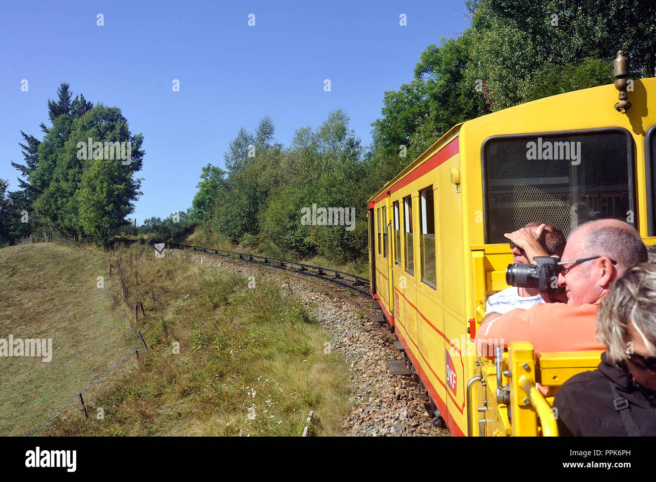 The little yellow train of the Pyrenees Crossing mountain landscapes ...