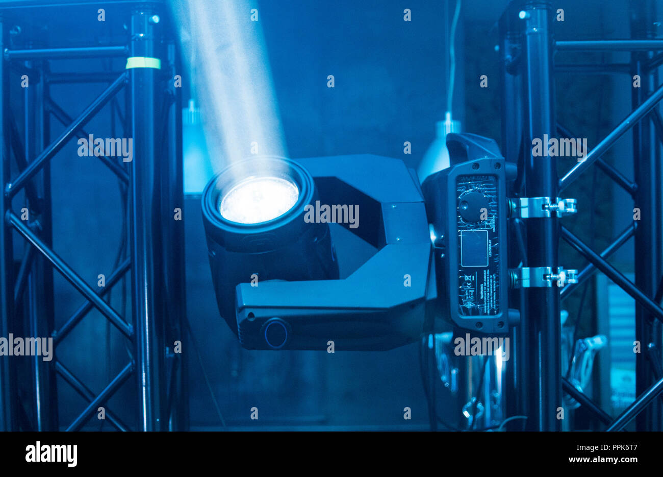 Switched on stage lights under the blue light. Light moving head for ...