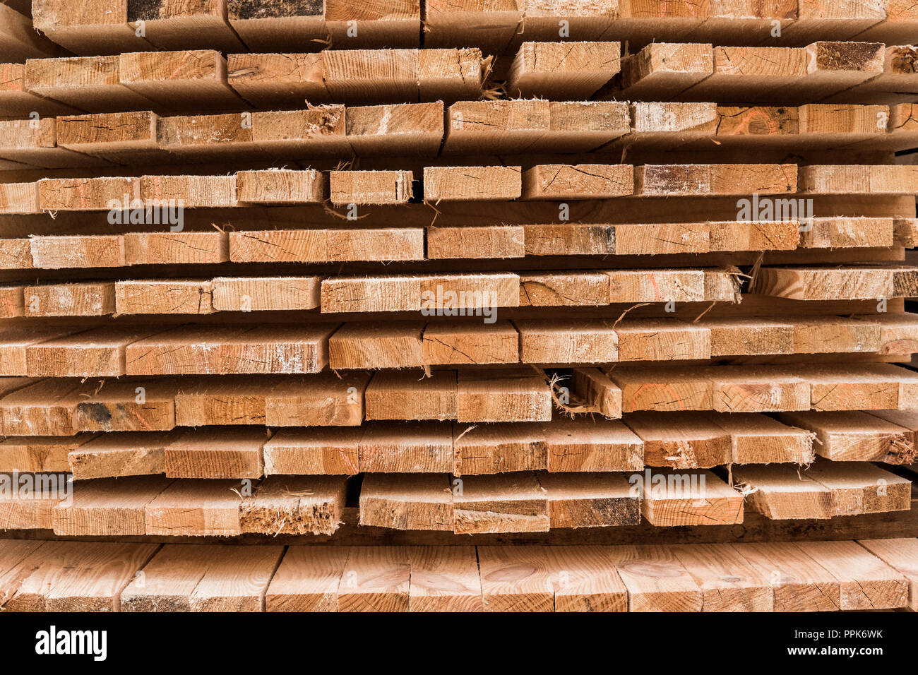 Piles of wooden boards in the sawmill, planking. Warehouse for sawing ...