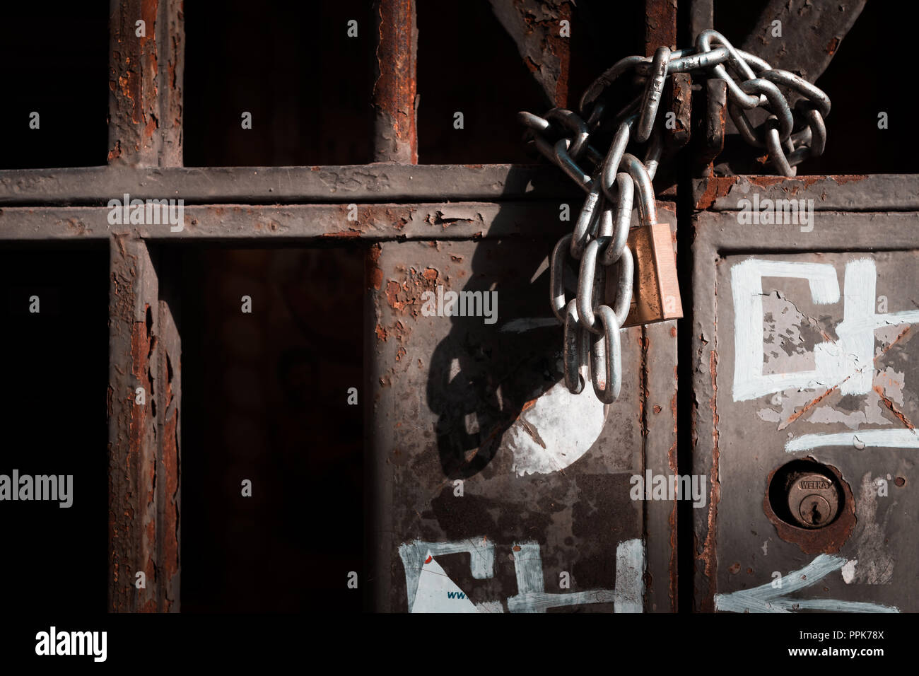 Rusty prison bars in maximum security facility. Darkness, evil ...