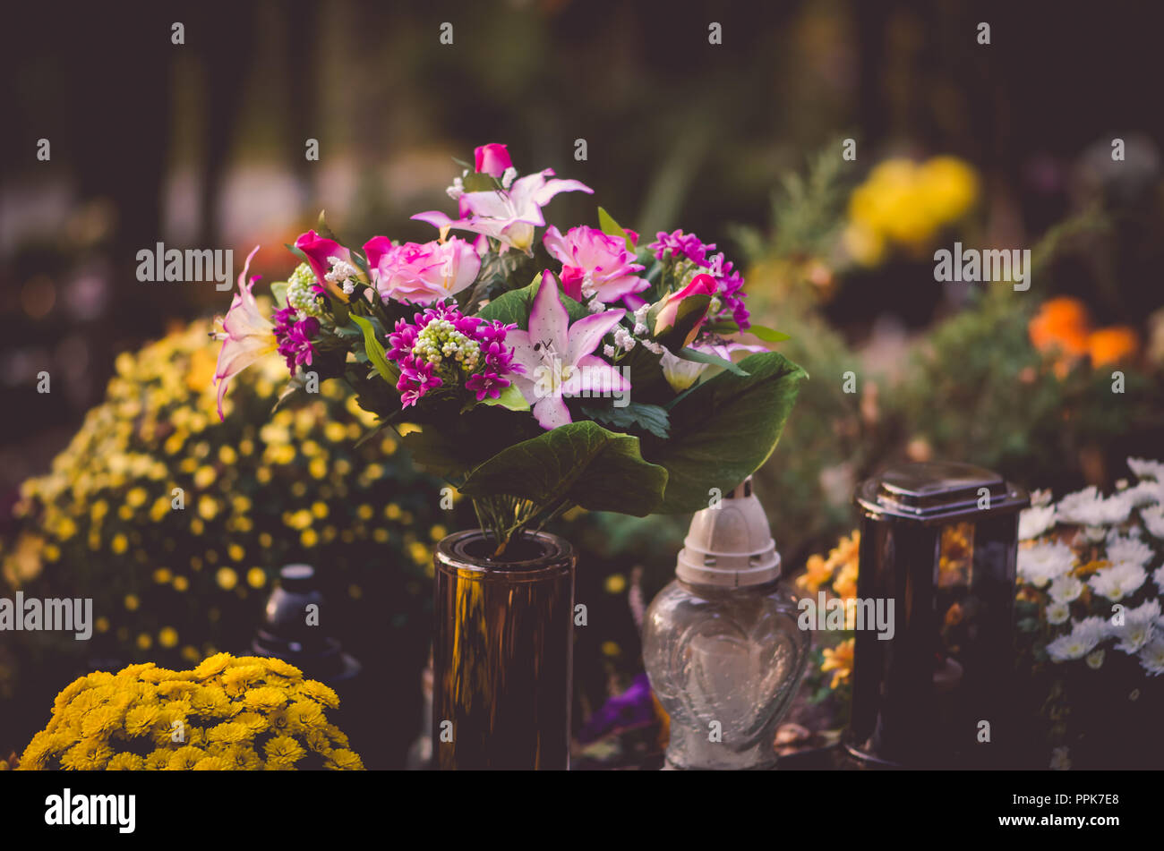 colorful flower decoration during All Saints Day at the cemetery Stock ...