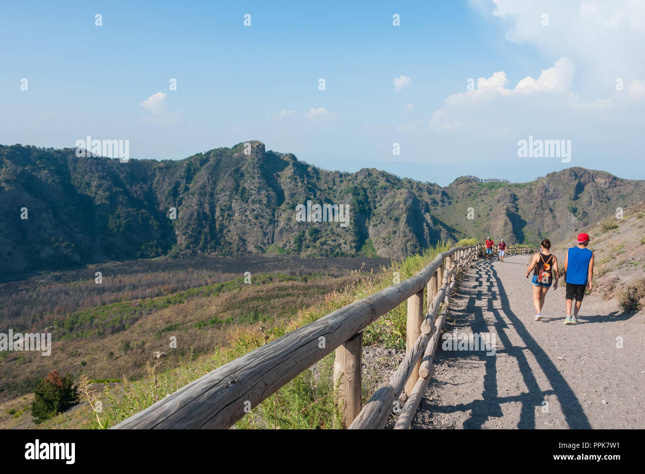 MOUNT VESUVIUS, ITALY - AUGUST 1, 2018: Tourists walk around the crater ...