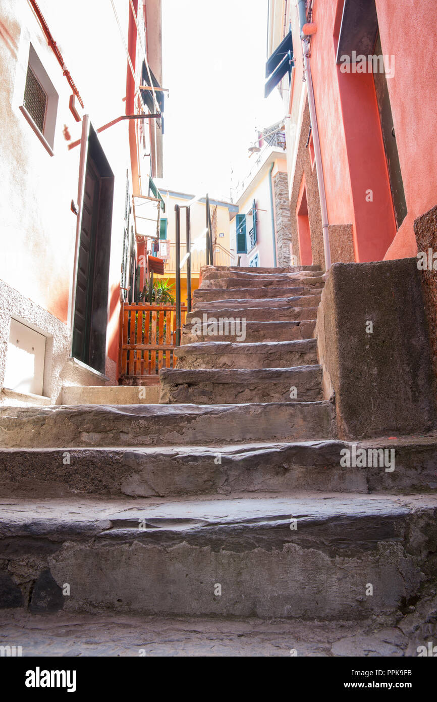 Old steps leading up between two buildings in typically small Italian ...