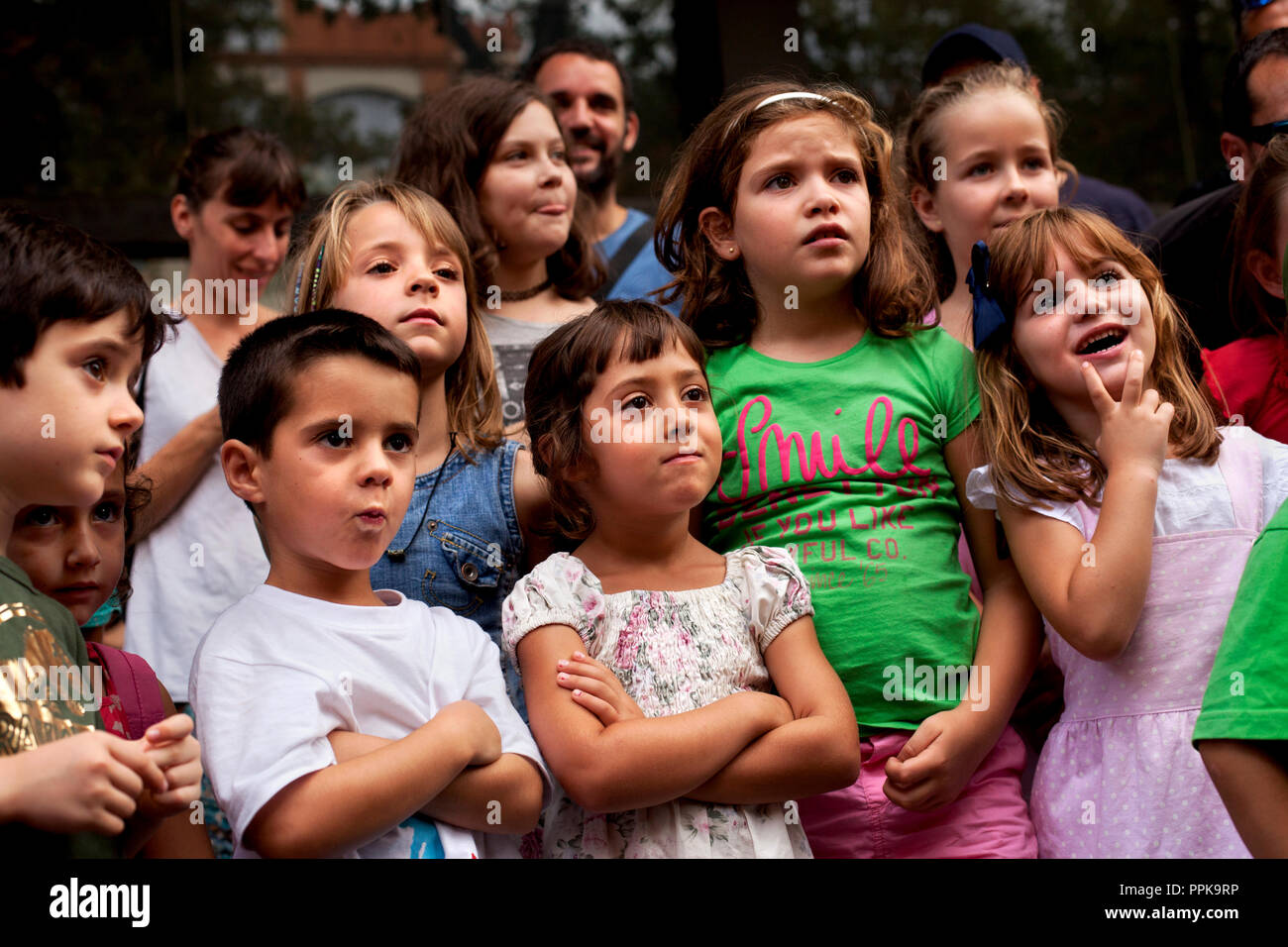 Children watching a street performance, Barcelona, Spain Stock Photo ...
