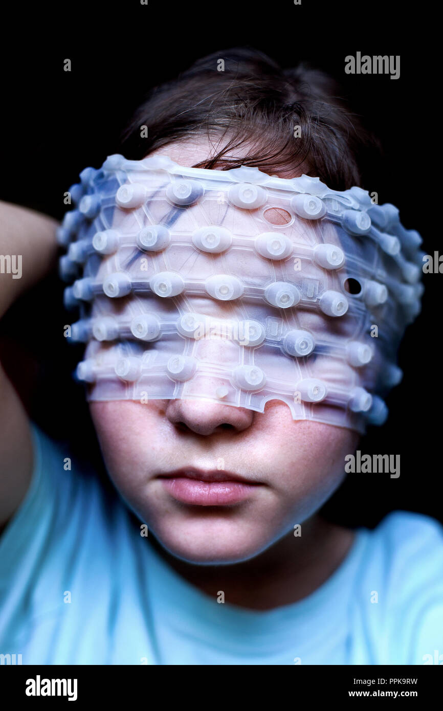 Boy with 'octopus' mask Stock Photo - Alamy