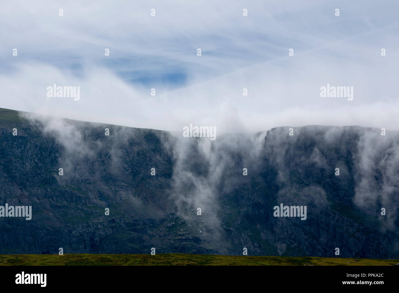 Clouds cascading over Snowdon Stock Photo - Alamy