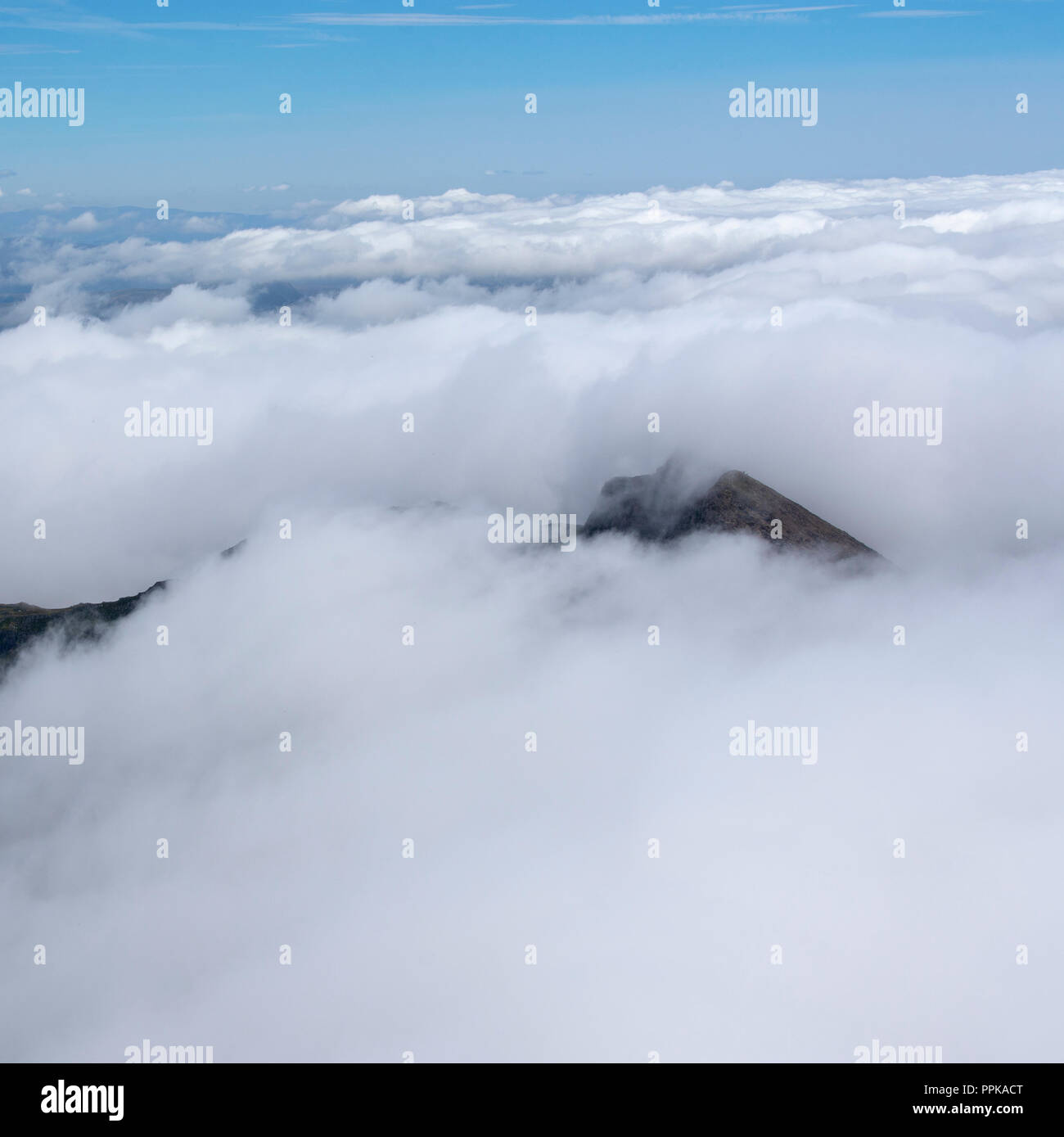 Cloud shrouded Y Lliwedd viewed from the top of Snowdon Stock Photo - Alamy