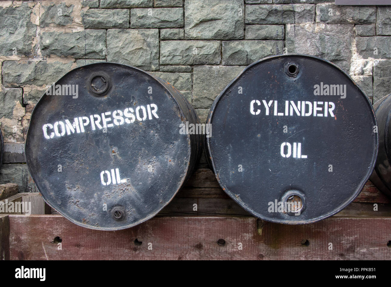 Compressor and Cylinder oil barrels Stock Photo - Alamy
