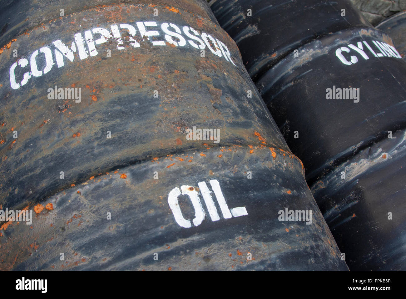 Compressor and Cylinder oil barrels Stock Photo - Alamy