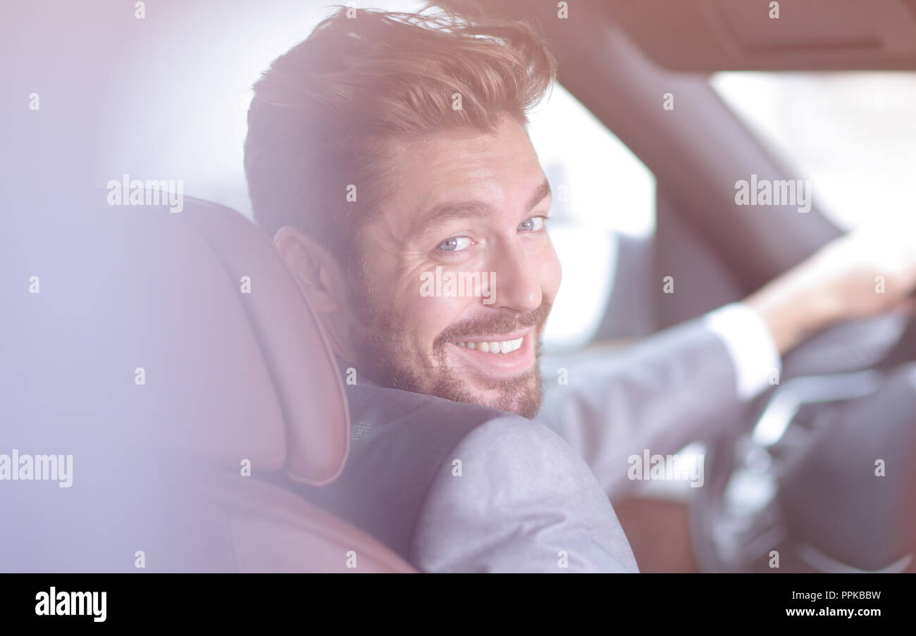 Successful man sitting behind the wheel of a prestigious car Stock ...