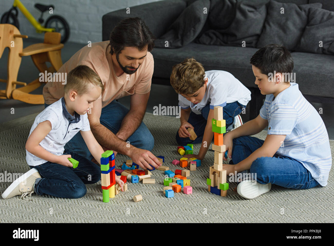 Adorable kids playing together blocks hi-res stock photography and ...