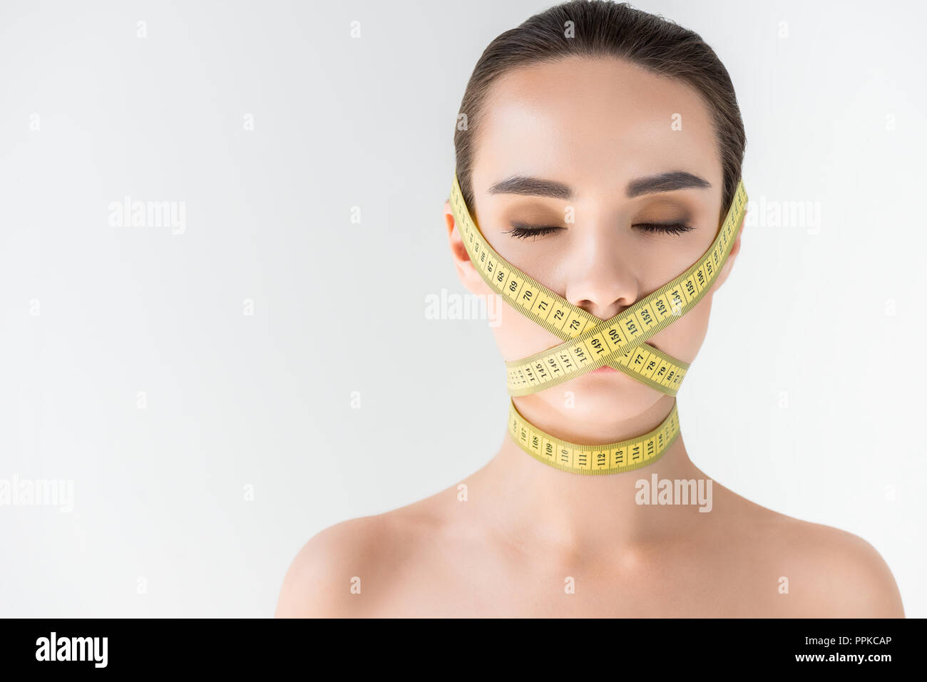 Woman tape measure mouth hi-res stock photography and images - Alamy