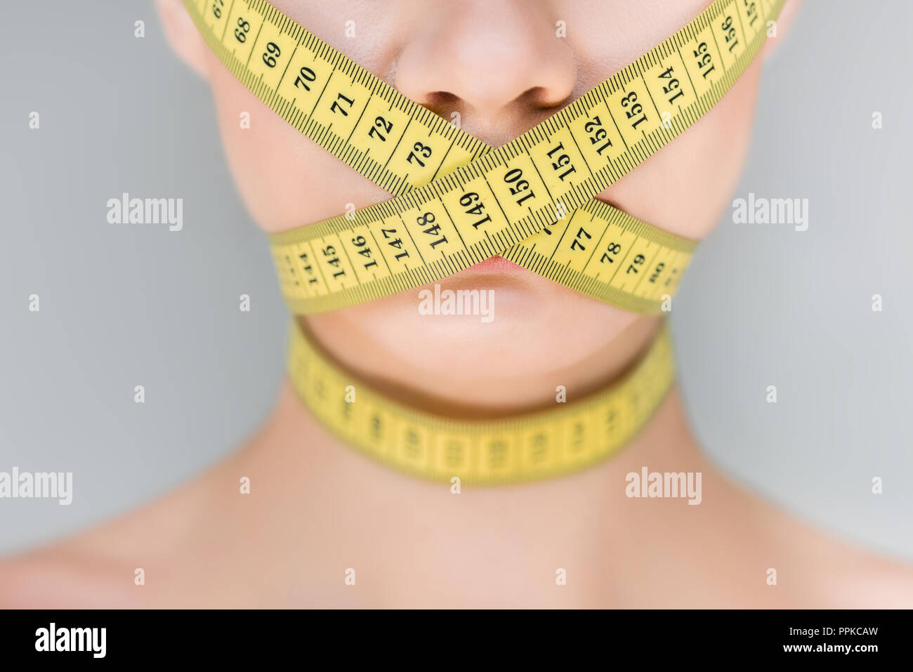 Woman tape measure mouth hi-res stock photography and images - Alamy