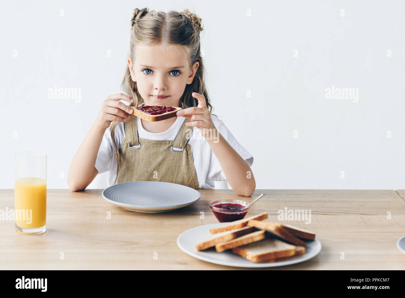 Kid eating jam on toast hi-res stock photography and images - Alamy