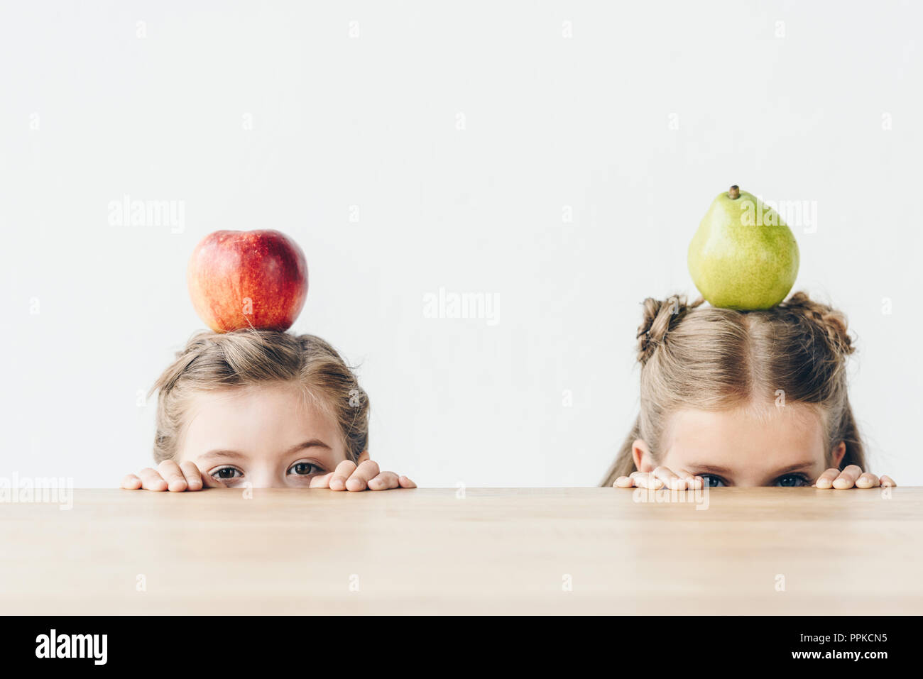 Children hiding behind table hi-res stock photography and images - Alamy