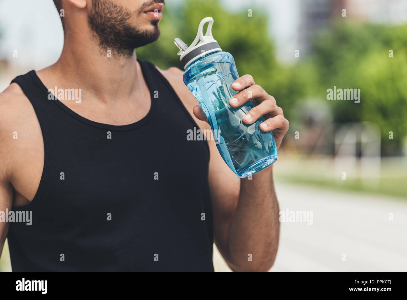 Sportsman drinking water from bottle hi-res stock photography and ...