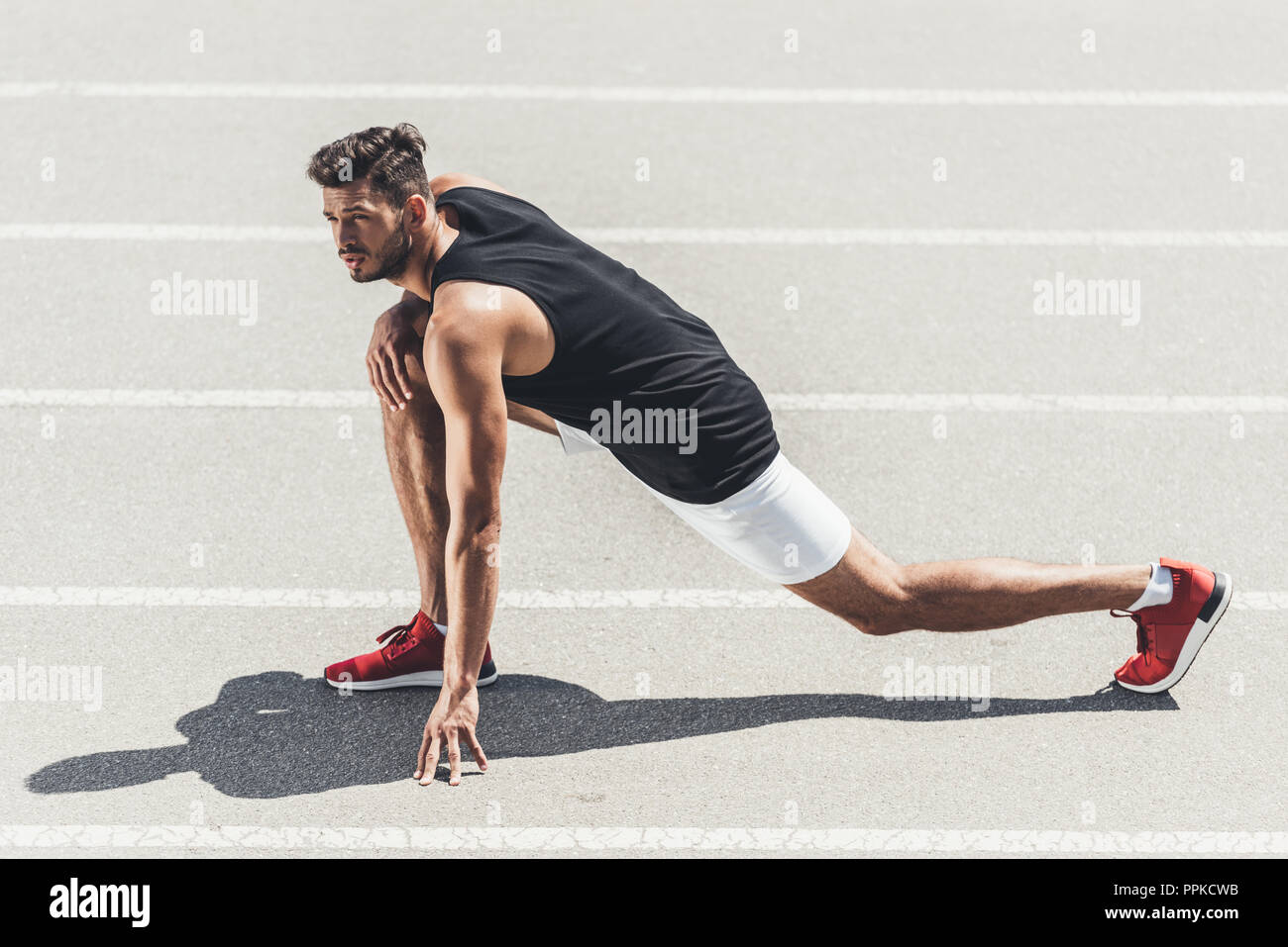Sprinter stretching hi-res stock photography and images - Alamy