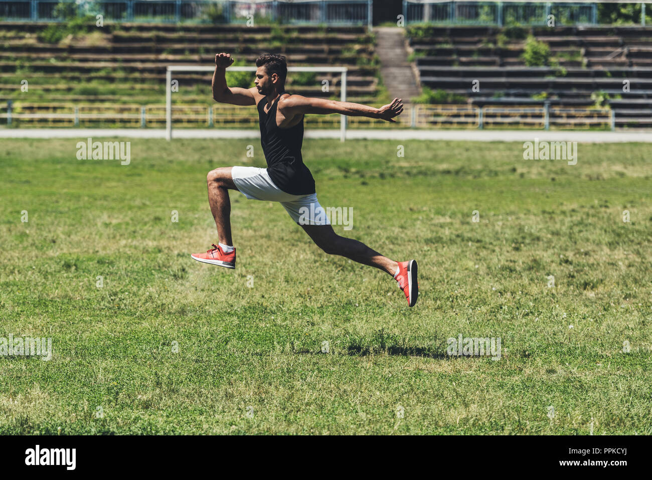 Side view young sportsman jumping hi-res stock photography and images ...