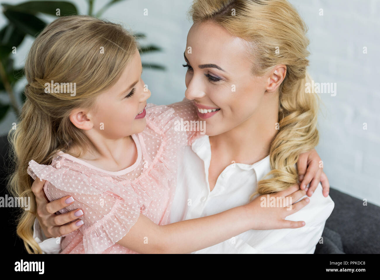 Happy mom daughter hugging other hi-res stock photography and images - Alamy