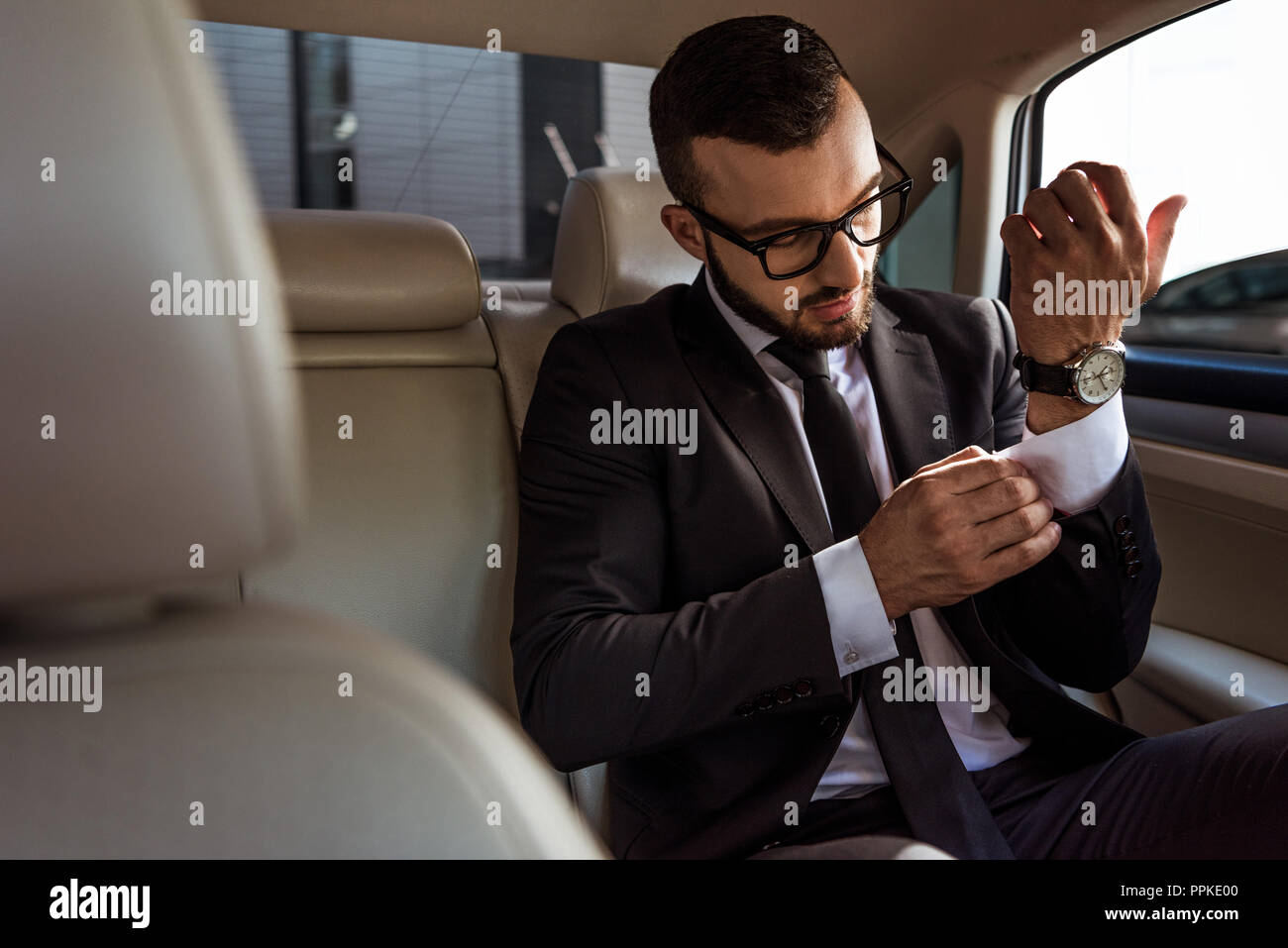 Buttoning cuffs hi-res stock photography and images - Alamy