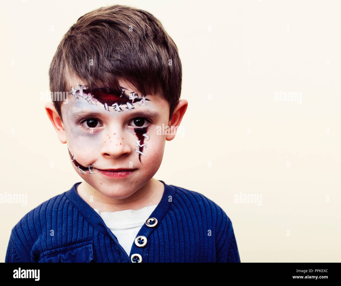 little cute child making facepaint on birthday party, zombie Apo Stock ...