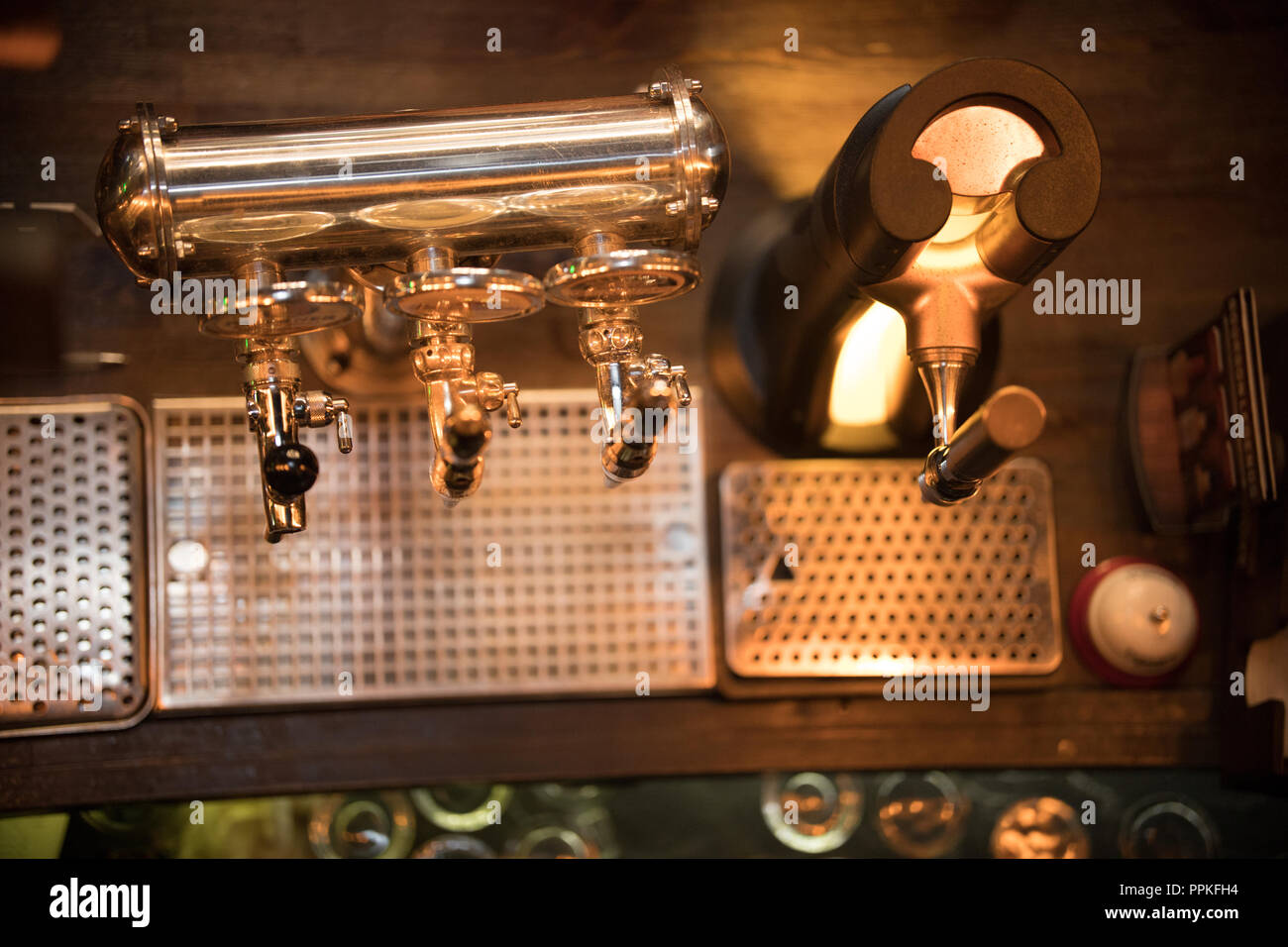 Shiny beer taps in the bar. View from above Stock Photo - Alamy