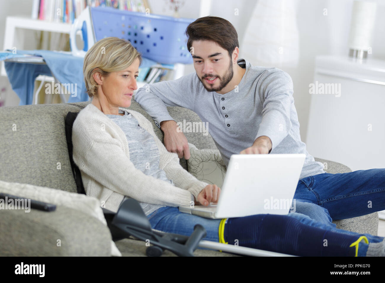 Young carer helping mother hi-res stock photography and images - Alamy