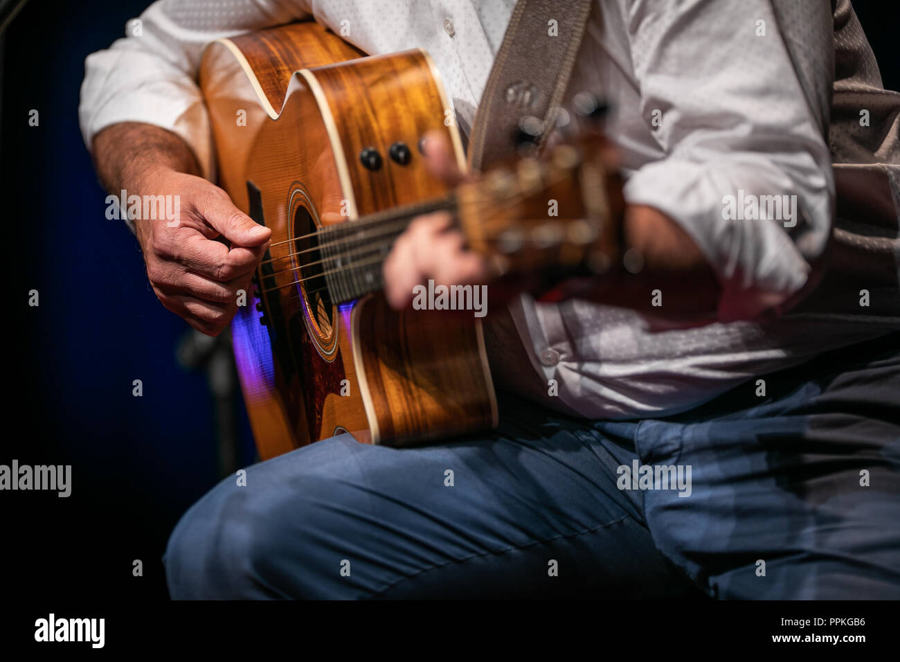 Man playing a guitar on stage (shallow DOF; color toned image Stock ...