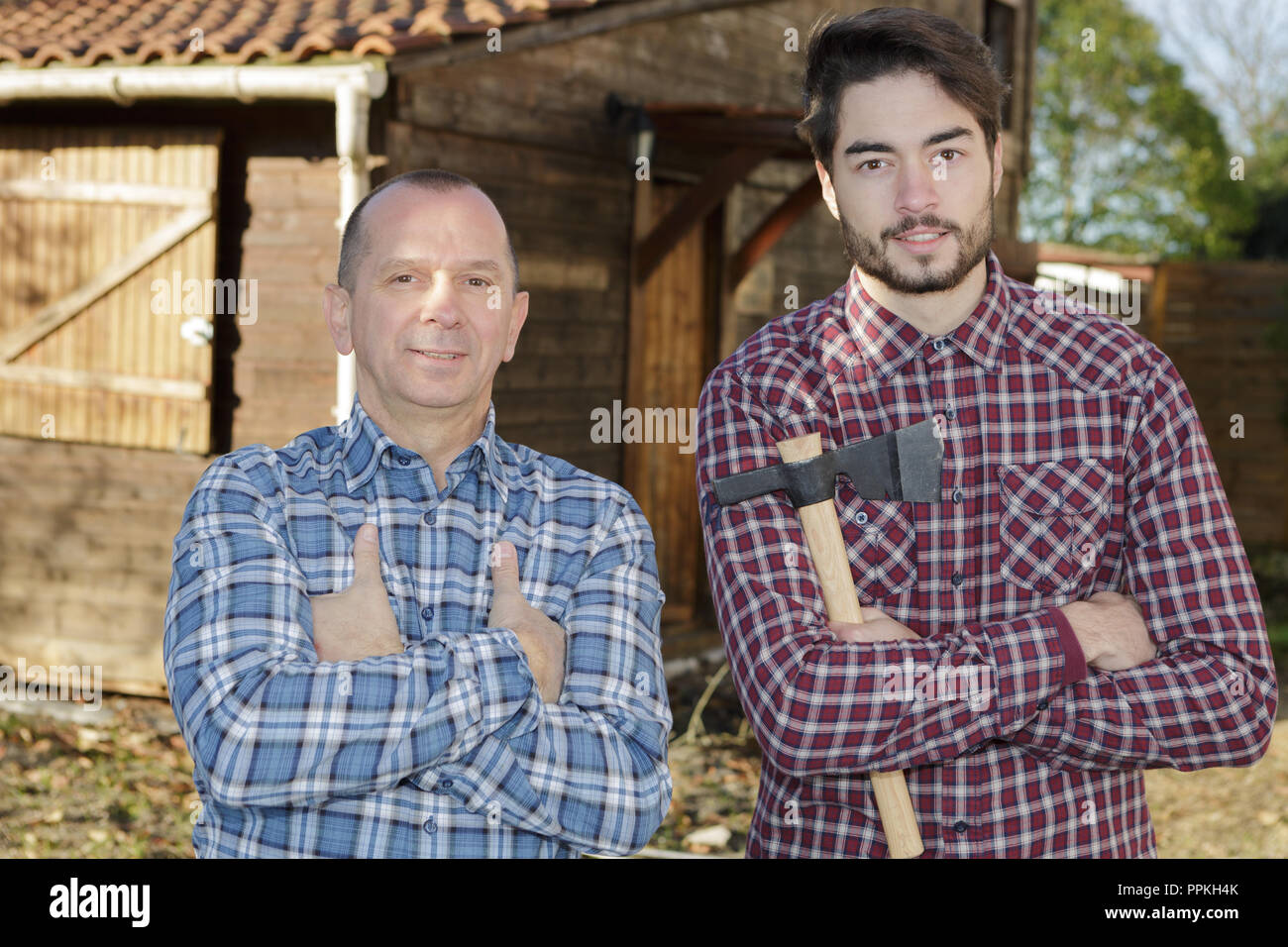 two lumberjacks outside building Stock Photo - Alamy