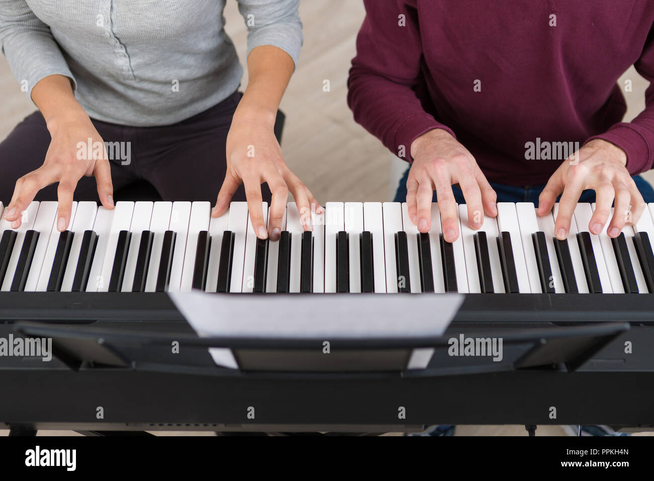 two person playing the keyboards Stock Photo - Alamy