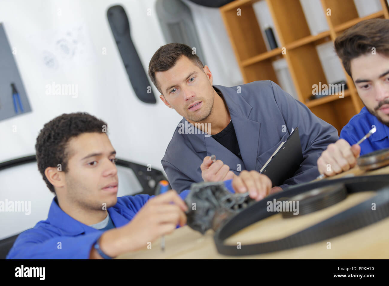young apprentices mechanics at work Stock Photo - Alamy
