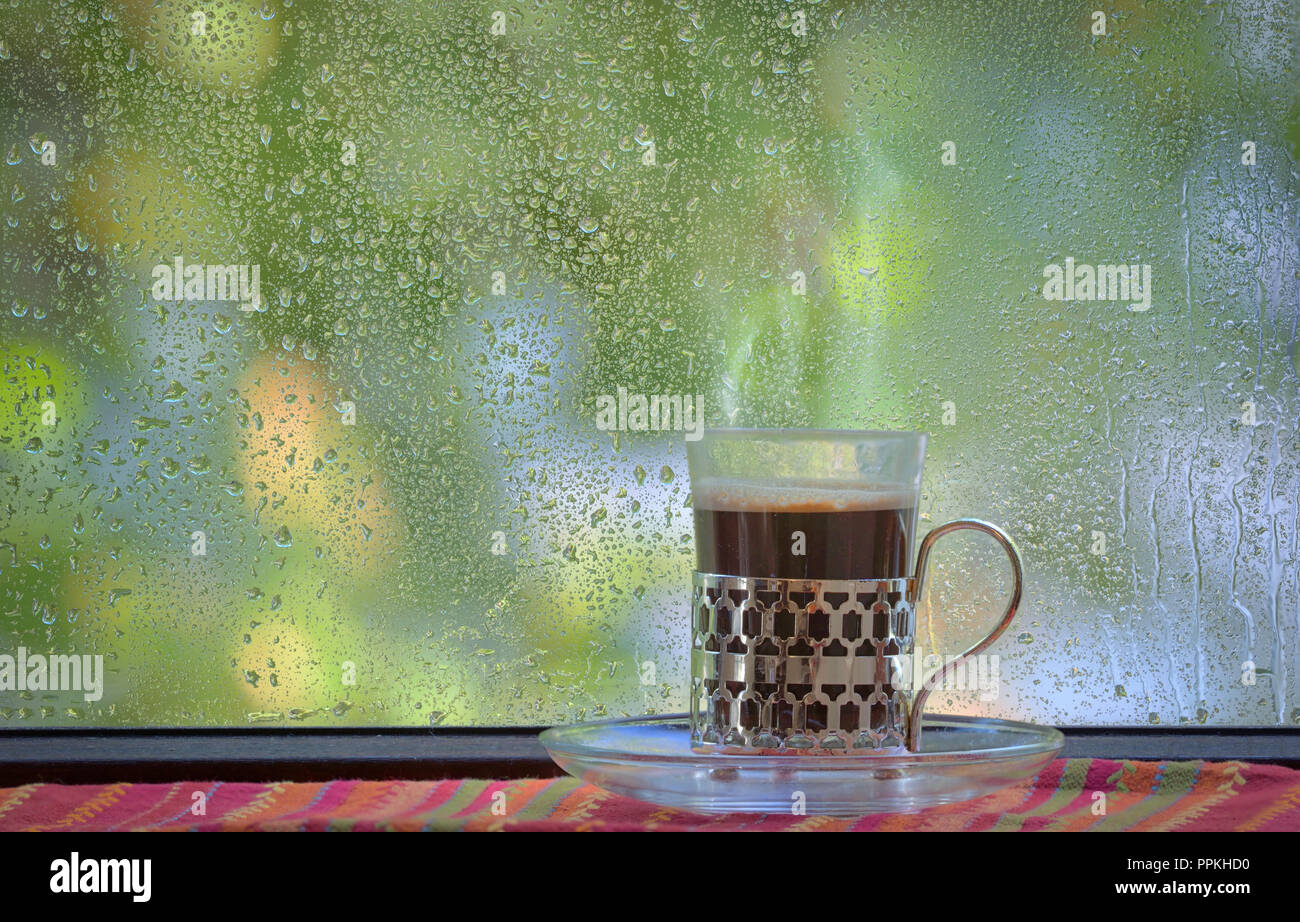 Fresh turkish coffee cup at rainy window Stock Photo - Alamy
