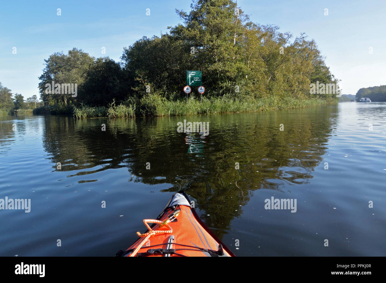 Junction on the River Ant north of Barton Broad with a sign pointing to ...