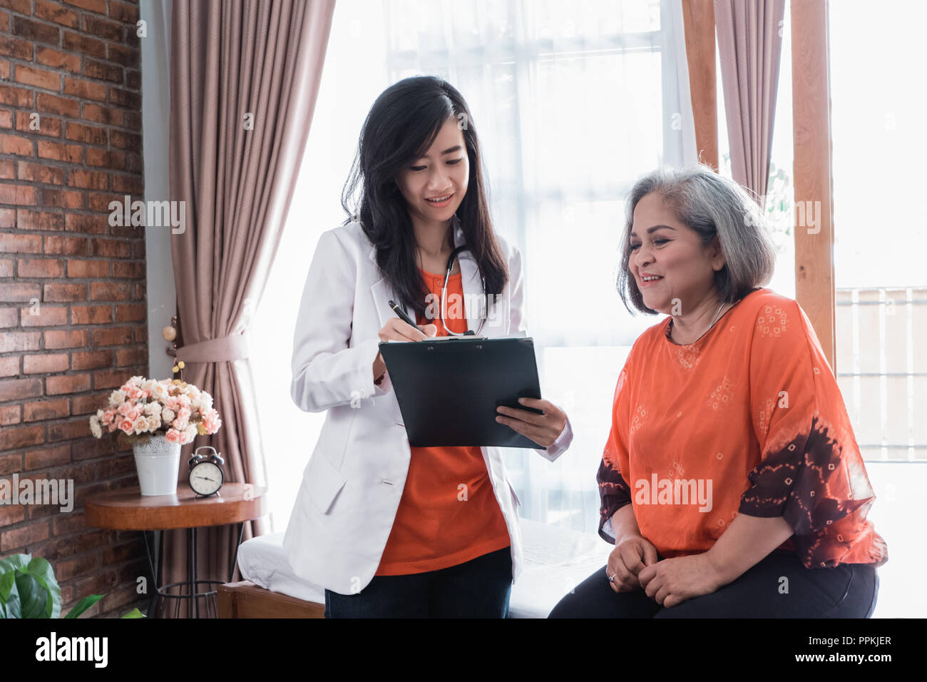 senior woman health check up Stock Photo - Alamy