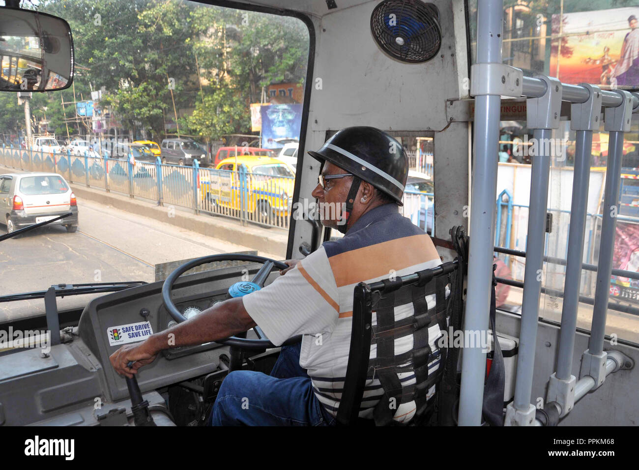 Kolkata, India. 26th Sep, 2018. Government bus drivers wear helmet as ...