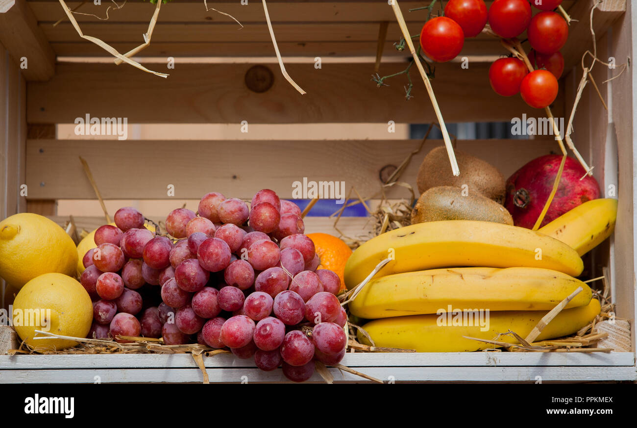 Heap of fresh fruits and vegetables on wooden photo zone on the holiday ...
