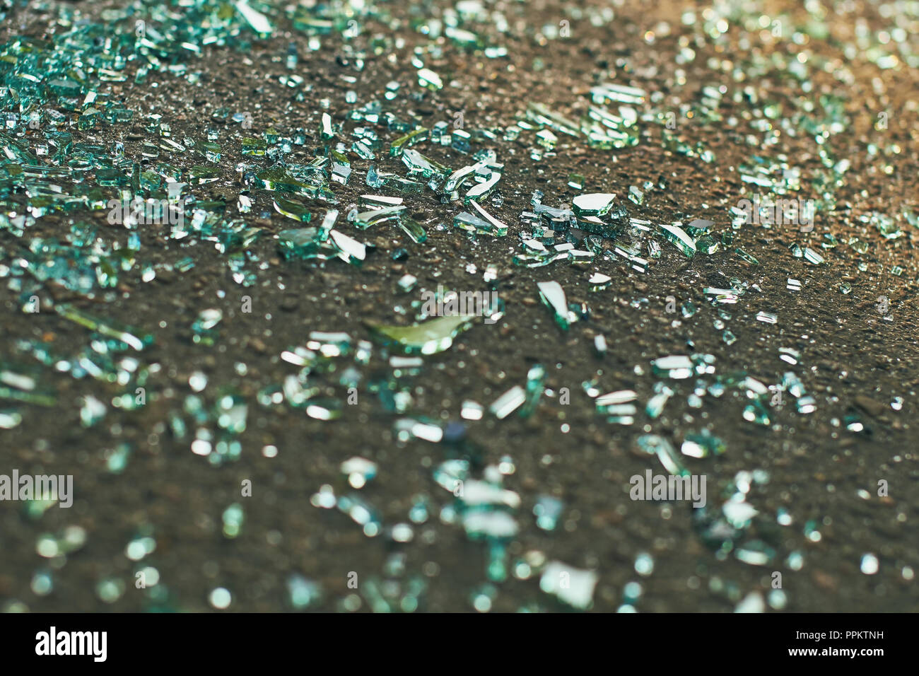 Broken glass on asphalt hi-res stock photography and images - Alamy