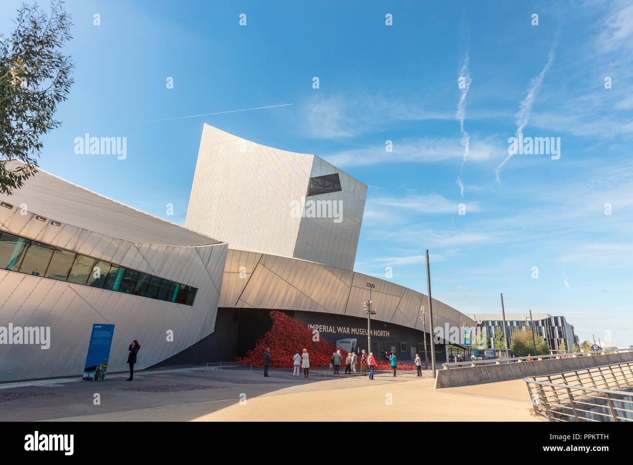 Imperial War Museum North with the iconic red poppy sculpture Wave by ...