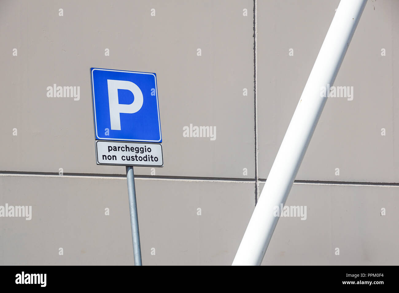 road sign parking . written in Italian which means : unattended parking ...