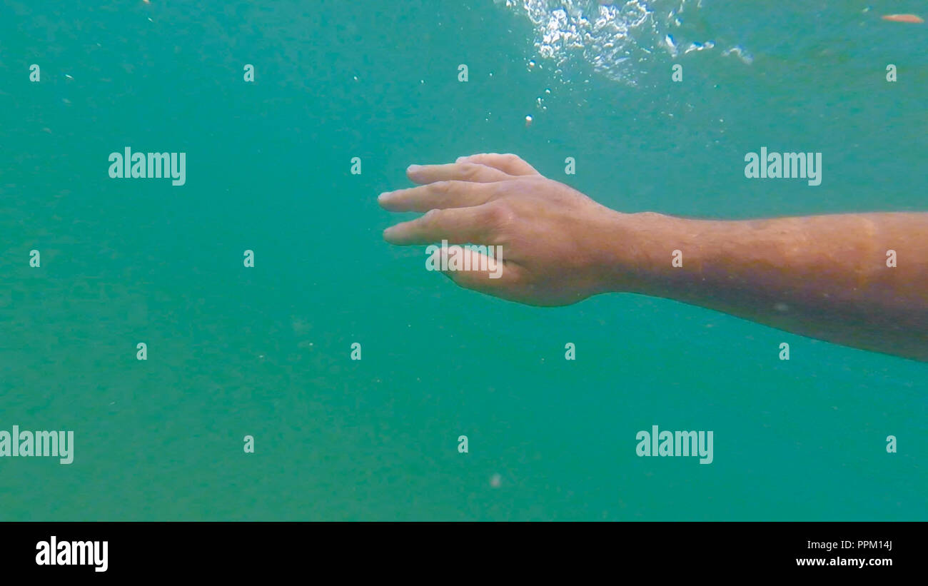 Underwater photo of male hand under the water of the sea Stock Photo ...