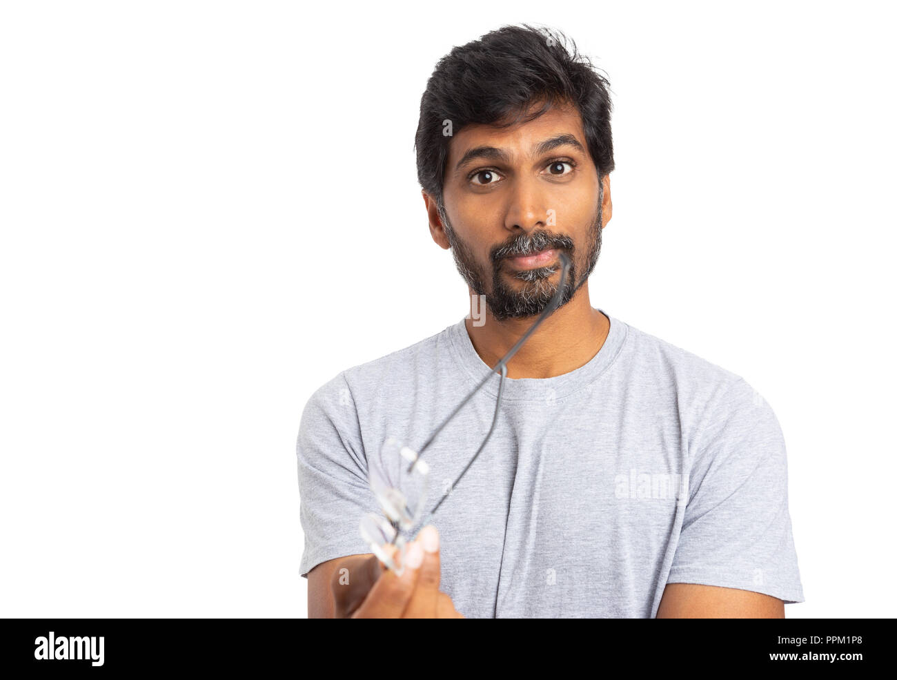 Indian man gesturing with eyeglasses or spectacles with approving ...