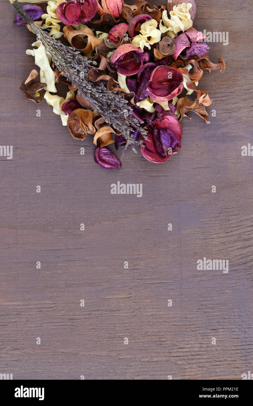 Potpourri mixture with lavender on a purple wood background with copy ...