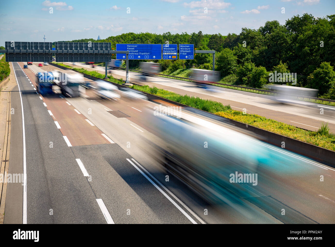 Multilane Autobahn highway with blurred trucks and cars near Frankfurt ...