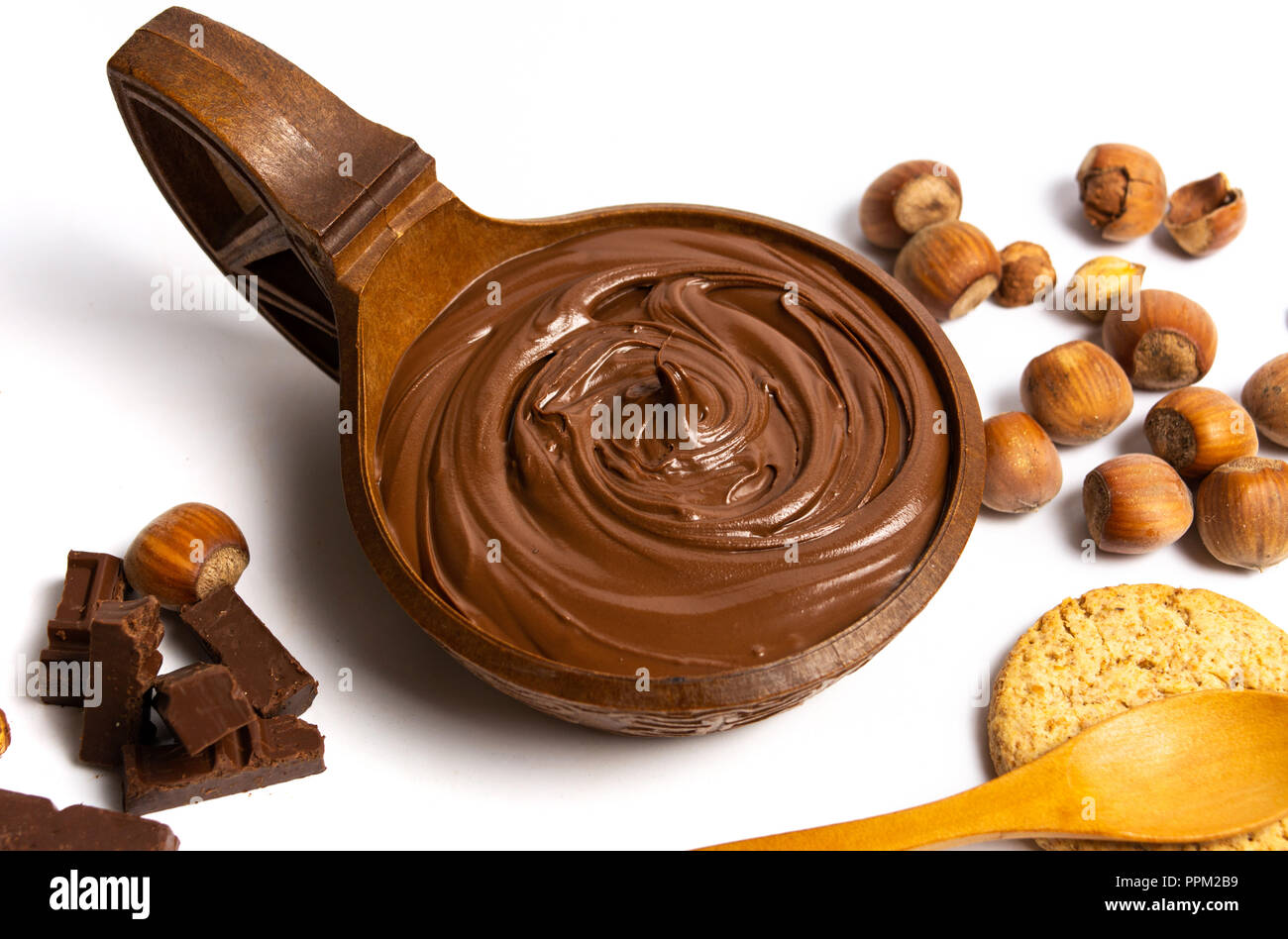 Hazelnut spread in a bowl isolated on white Stock Photo - Alamy