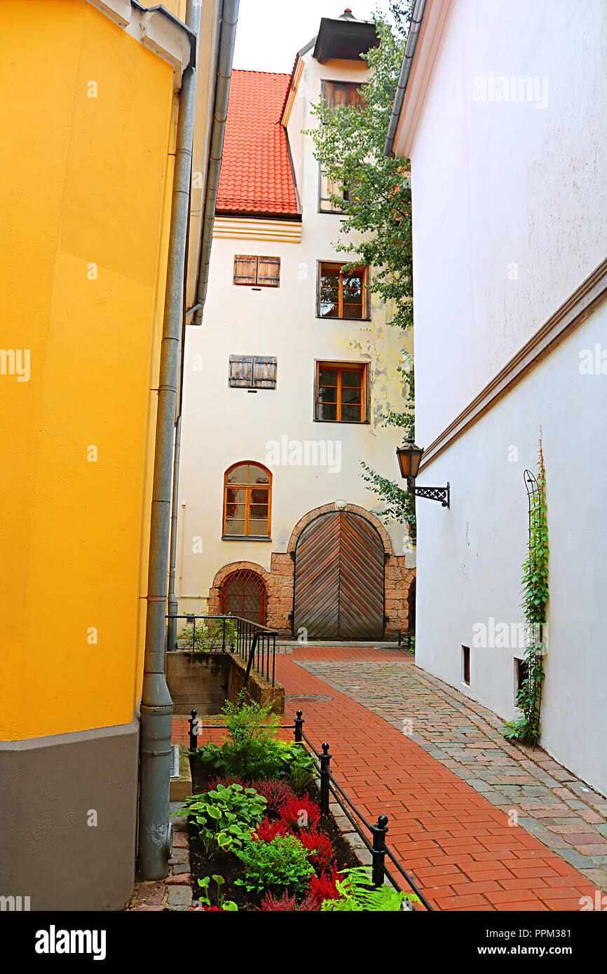 Medieval street in old Riga, Latvia, Europe. In old Riga tourists can ...