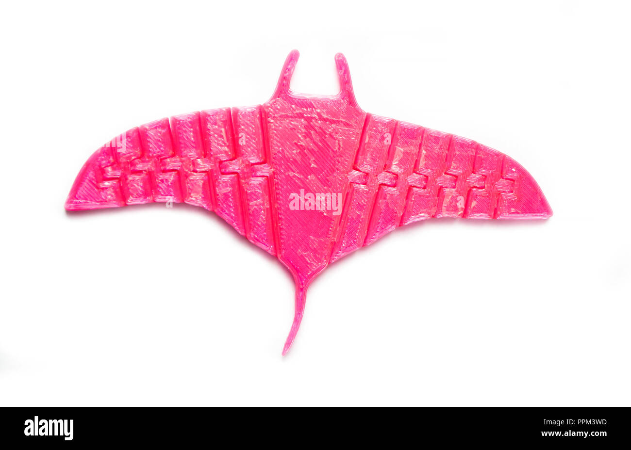 Bright light pink object in shape of Stingray toy printed on 3d printer ...