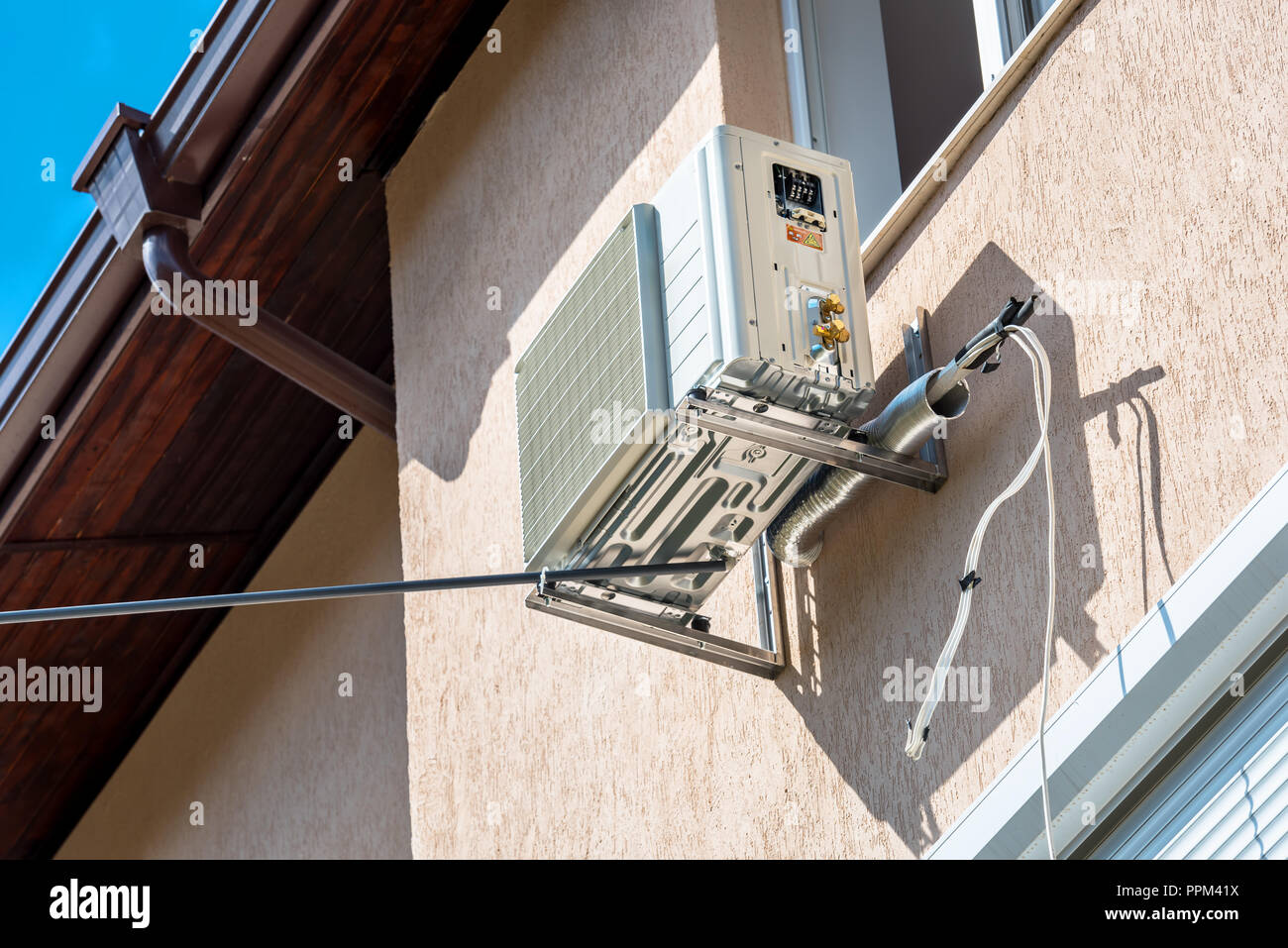 Air condition outdoor unit compressor install outside the house Stock ...