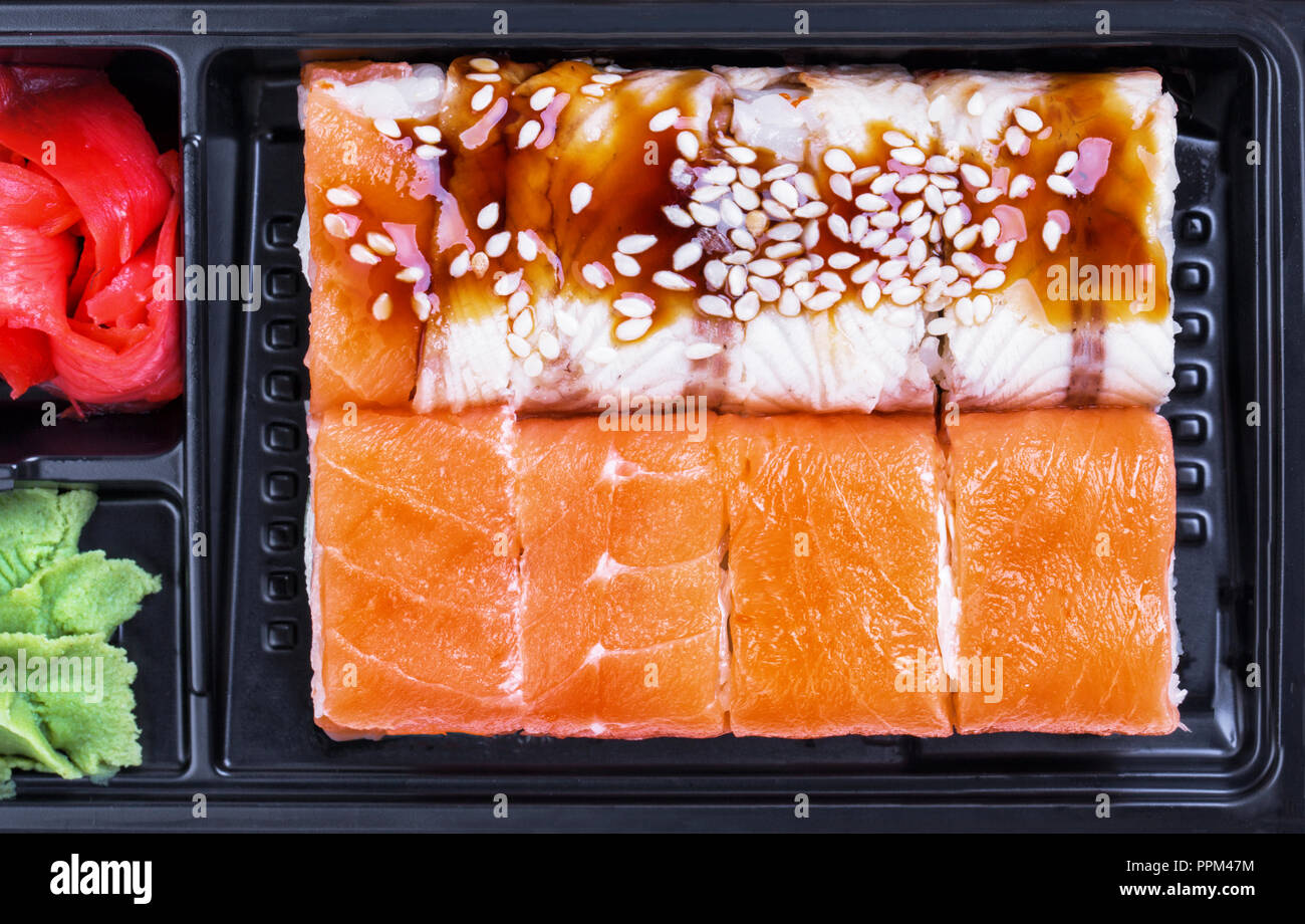 Set of mix rolls of Philadelphia and eel in a black container "take it ...